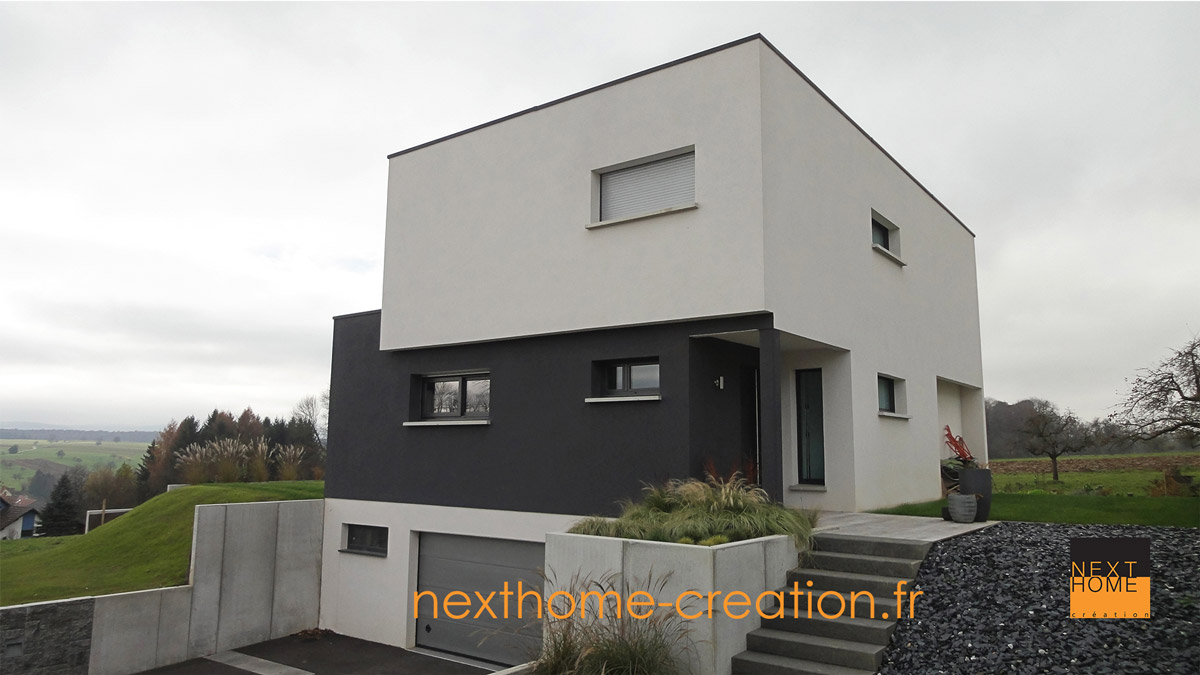 Maison contemporaine à toit plat et garage sous-sol - Nexthome Création